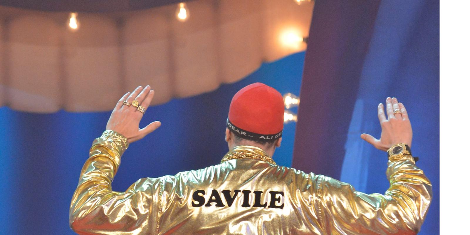 Sacha Baron Cohen Brings Back Ali G In Savile Tracksuit At Comedy Awards